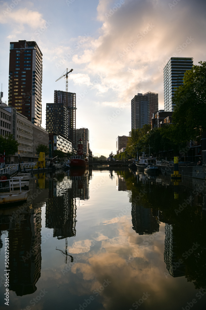 Sunrise on the streets of Rotterdam. Beautiful wide angle view with the ...