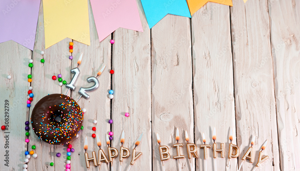 Birthday with number 12. Donut on the festive table. Happy birthday ...