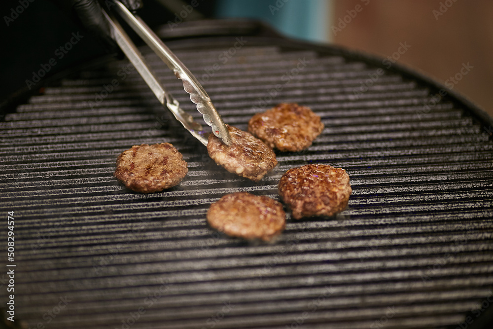 Cooking meatballs on the grill. meatballs are grilled. grilled cutlets ...