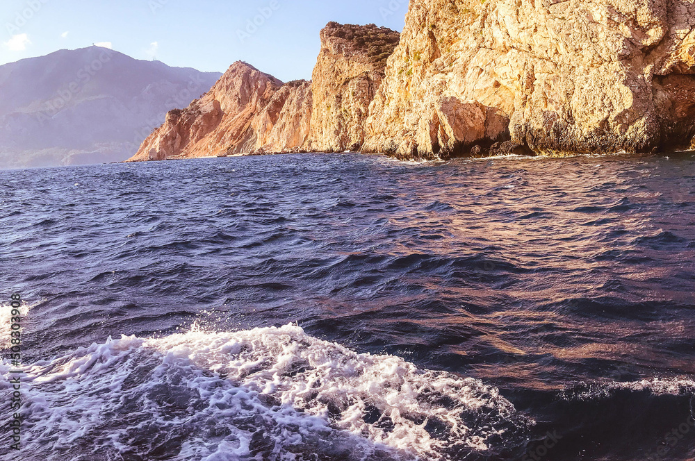 rock in the sea. blue expanse of water, sea surf, waves with white foam ...