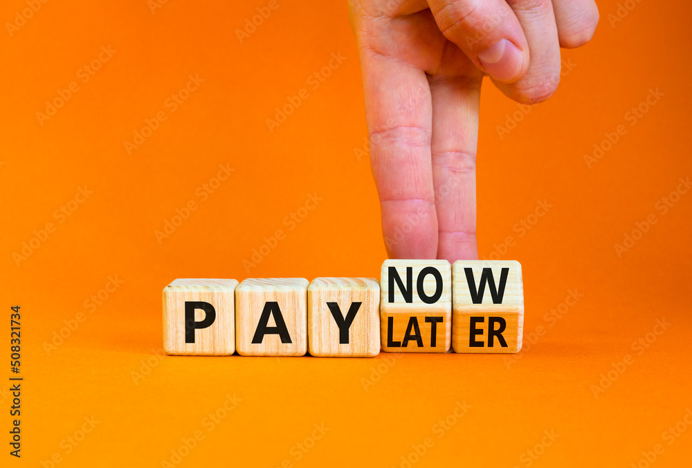Pay later or now symbol. Businessman turns wooden cubes and changes ...