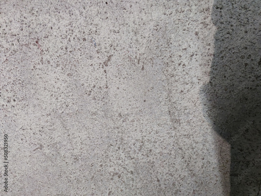 Smooth cement surface. Light gray concrete surface with bulges and ...