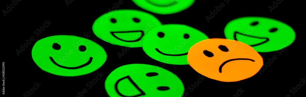 representation of a sad person in a group of happy people. racism ...