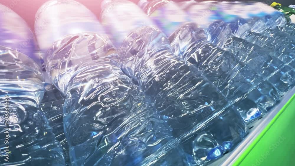 Mineral water in one and a half liter plastic bottles line up on ...