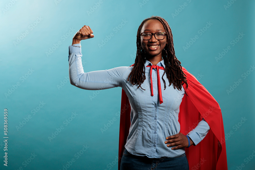 Arms muscle flexing brave superhero woman posing strong and tough for ...