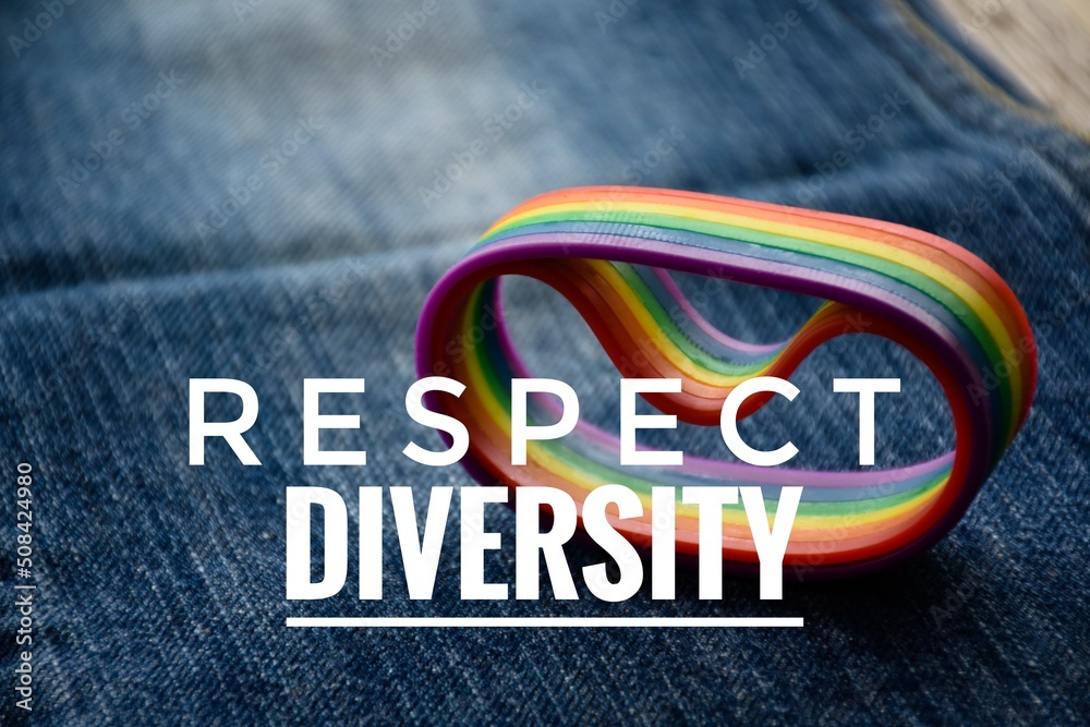 'RESPECT DIVERSITY', and rainbow wristband, symbol of lgbt, on blurred ...