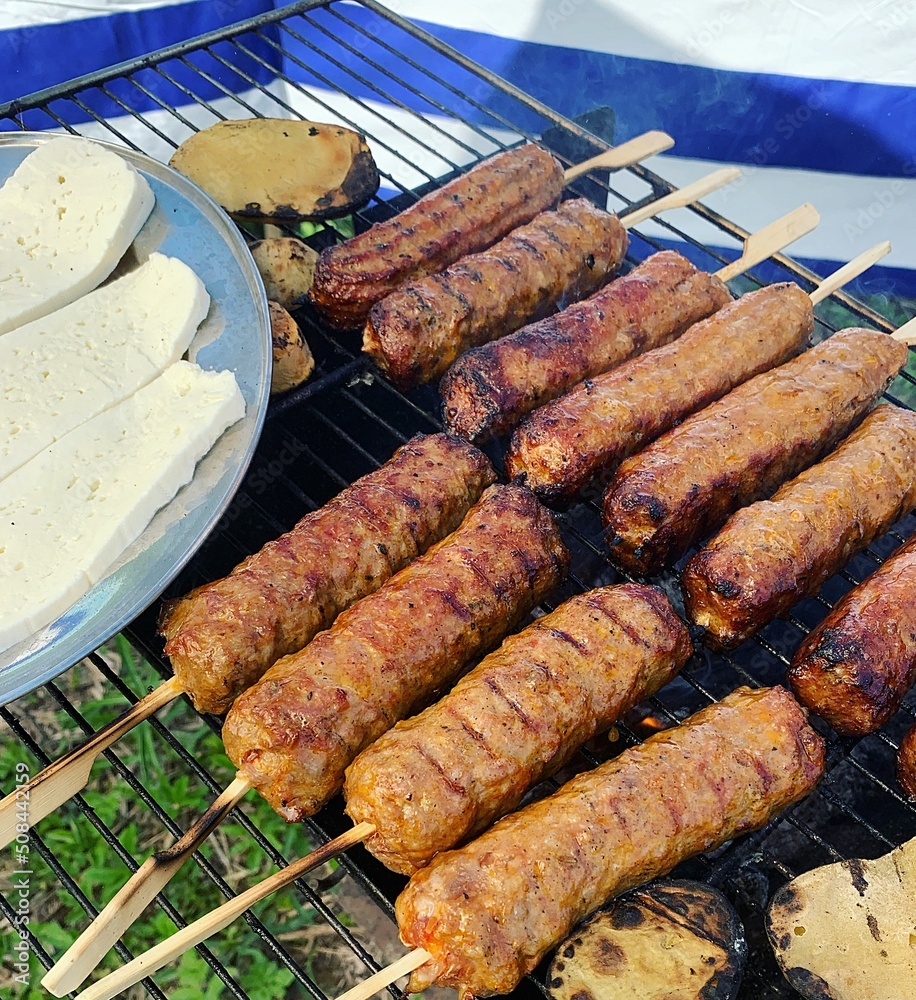 Croatian barbecue food, cevapcici on the grill, grilled cheese and ...
