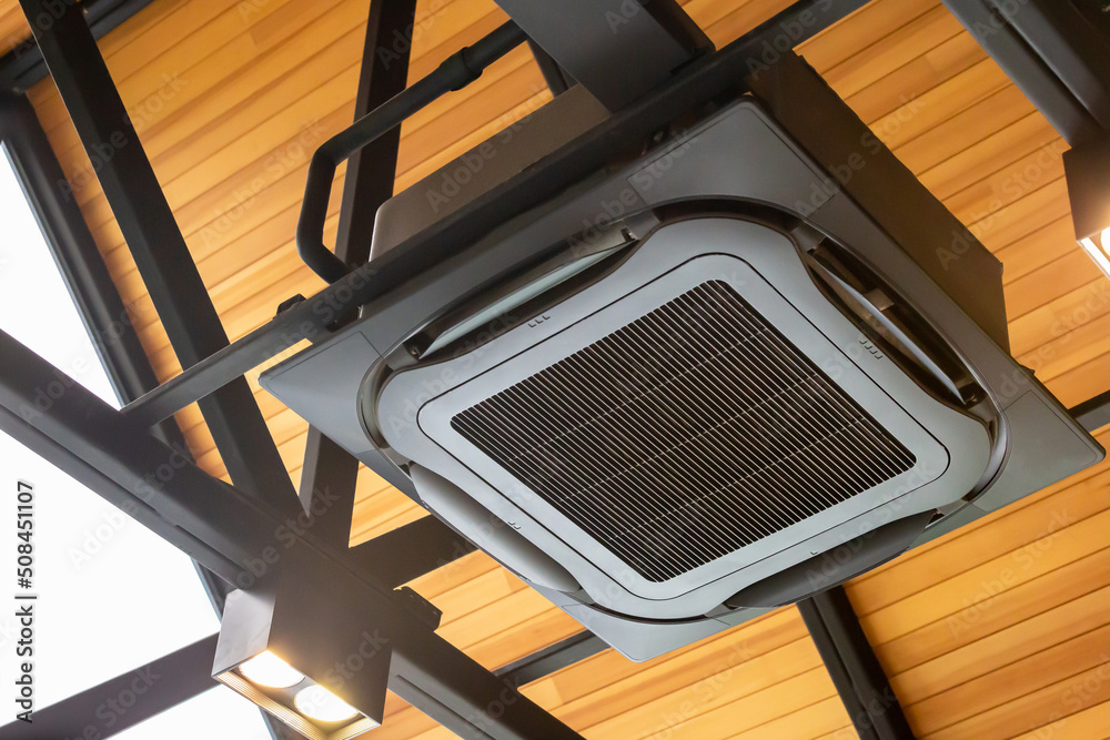 Modern ceiling mounted cassette type air conditioning system in coffee ...