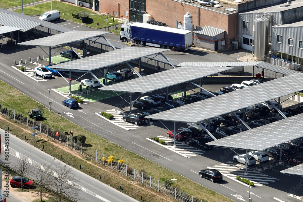 Aerial view of solar panels installed as shade roof over parking lot ...