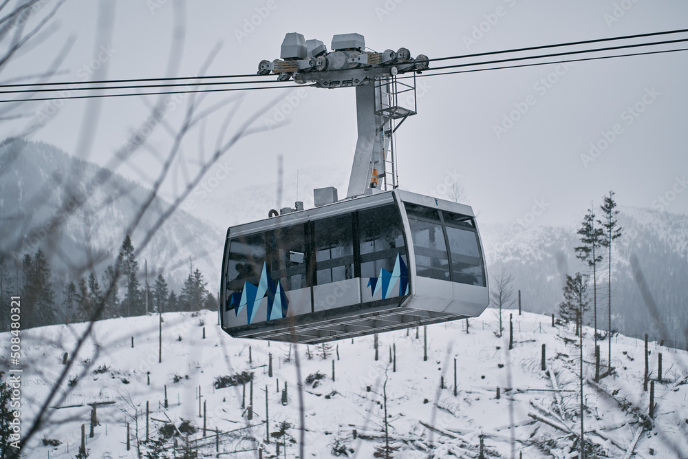 Chairlift cabin on a cable way. Concept of skiing and snowboarding ...