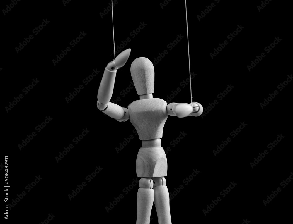 Puppet on strings. Exploit, control, abusive relationship concept ...