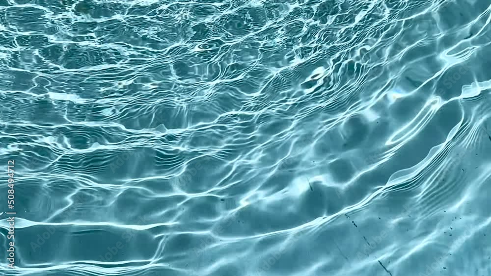 Pure blue water in pool with sun light reflections. Water background ...