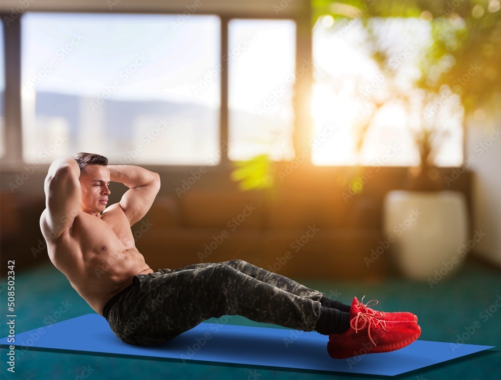 Performed by a fit guy lying on a mat. Intense reciprocal exercise at a ...
