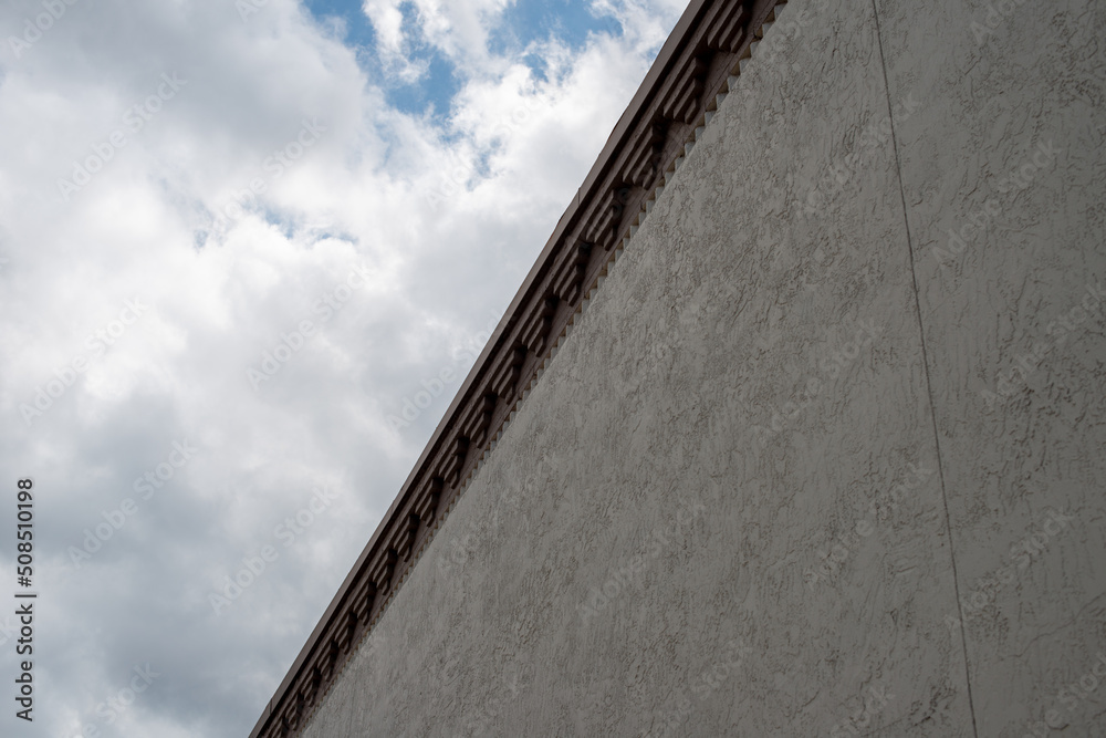 The upward view of an exterior wall of a concrete block building being ...