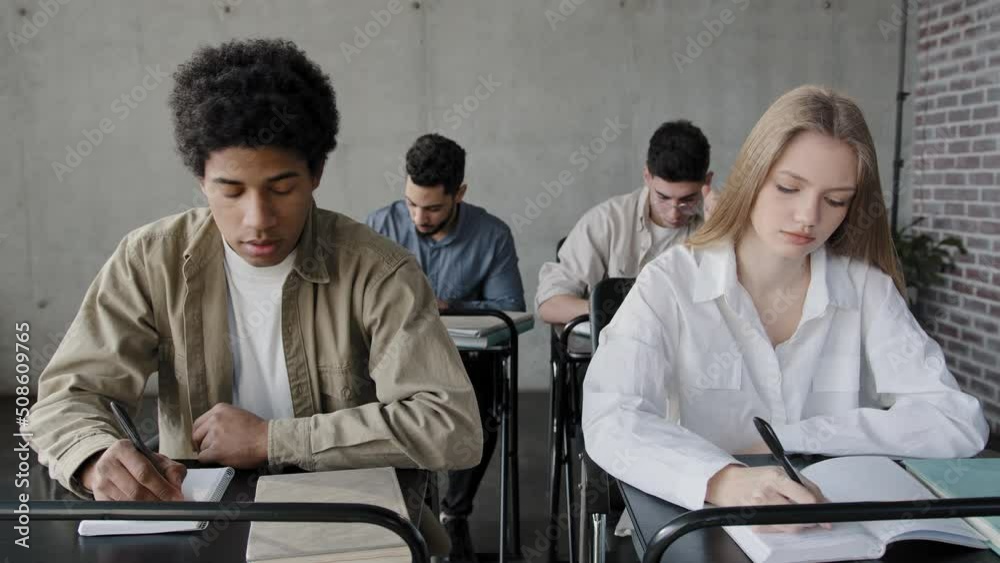 Diverse young group people classmates sitting in classroom at lecture ...