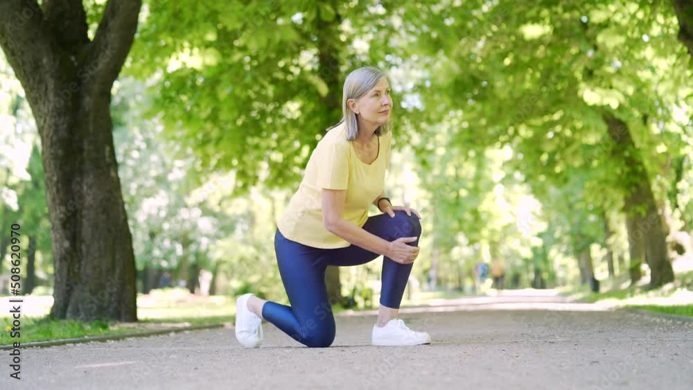Senior runner with muscle pain. Mature old woman massaging, trauma ...