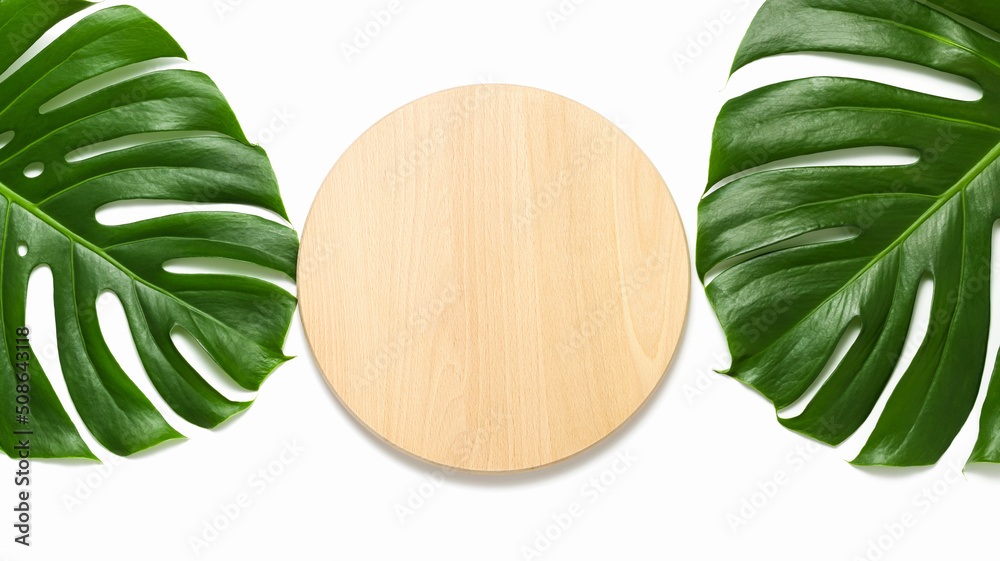 Round desk podium with tropical monstera leaves on white background for ...