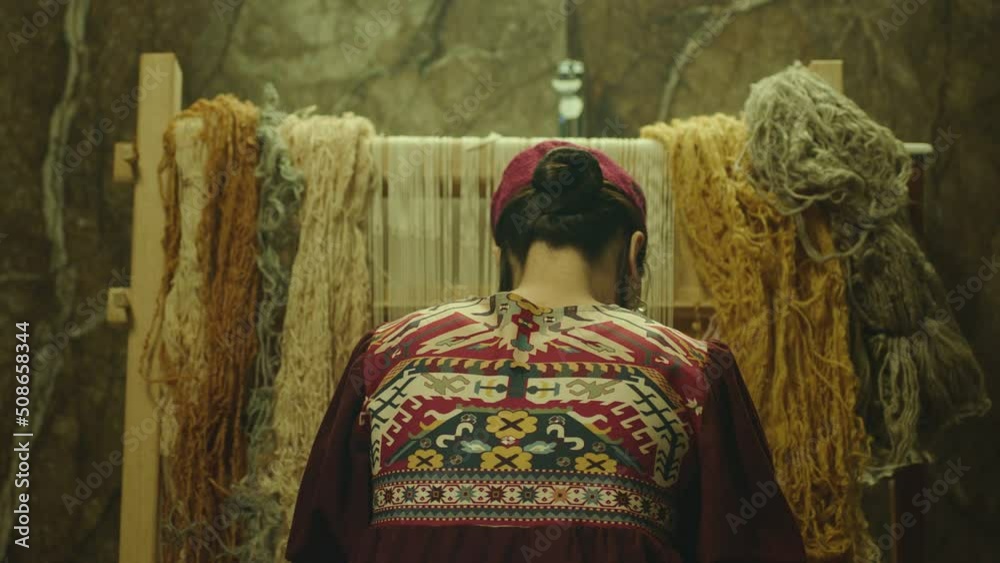 A Woman weaving traditional Asian carpet . Handmade carpet embroidery ...