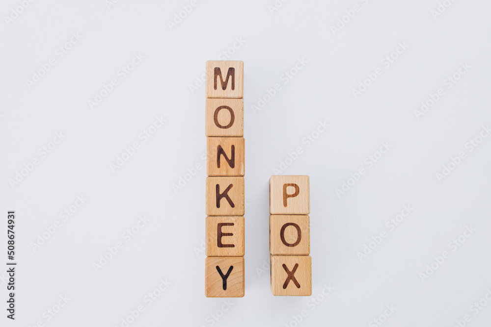 MONKEYPOX. Word written on square wooden tiles with an white background ...