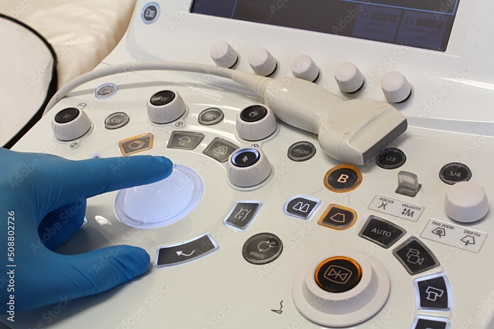 Plakat, Poster Doctor hand in blue sterile glove moving blue backlit ...