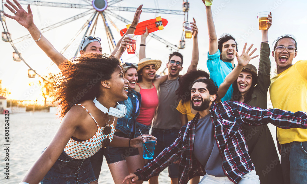 Multiracial group of friends having fun dancing on the beach - Happy ...