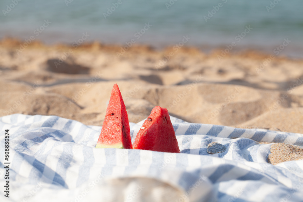 Watermelon on the beach on a sea background. Tropical fruits, healthy ...