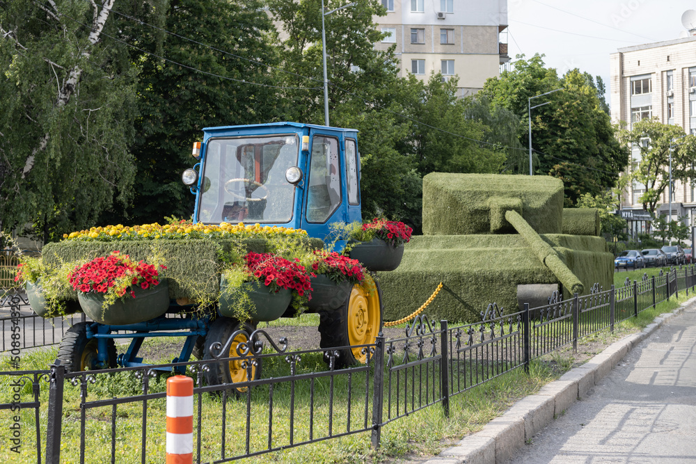 War of Russia against Ukraine. Ukrainian tractor dragging a captured ...