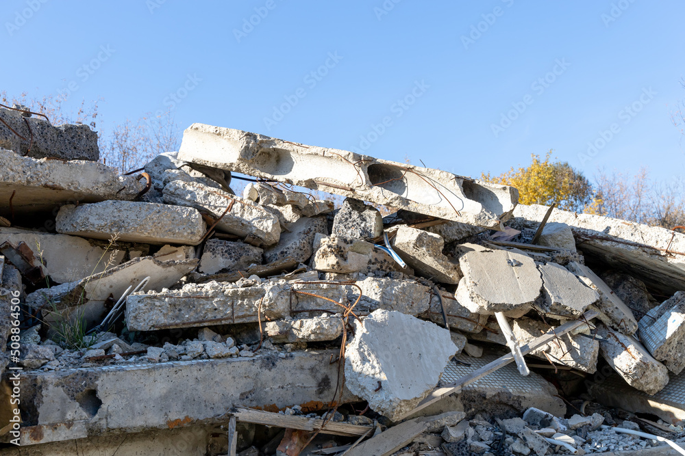Fragments of a destroyed concrete building. The wreckage of a ...