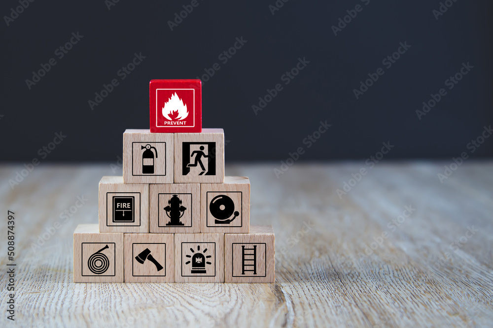 Cube wooden block stack with fire prevent icon and door exit sing or ...