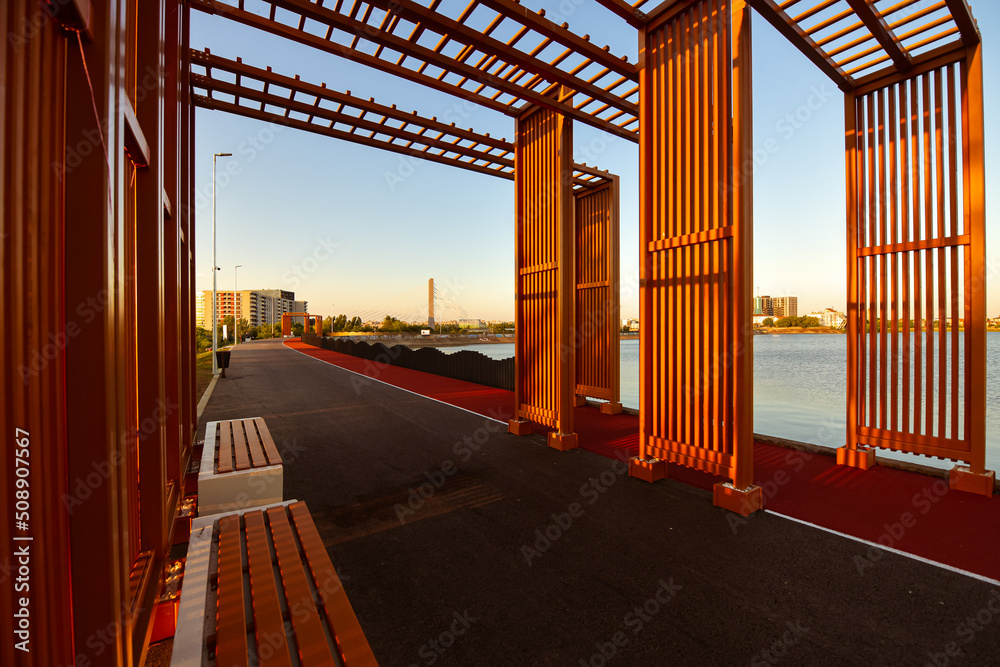 Sunrise in Bucharest. A beautiful morning in the new park promenade ...