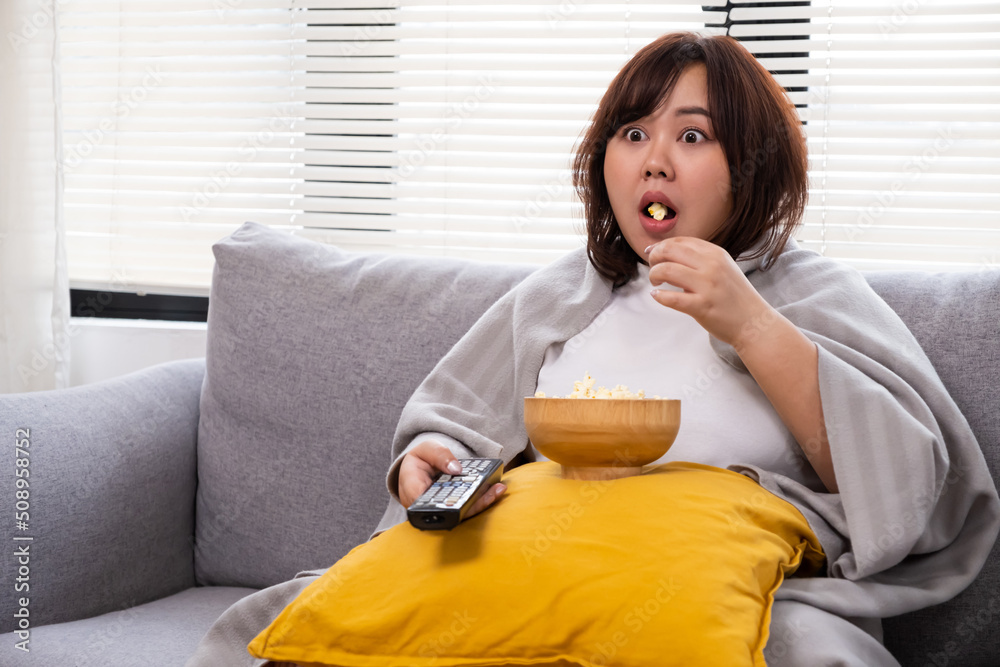 Young Asian oversize women gain weight while eating donut, bread and ...