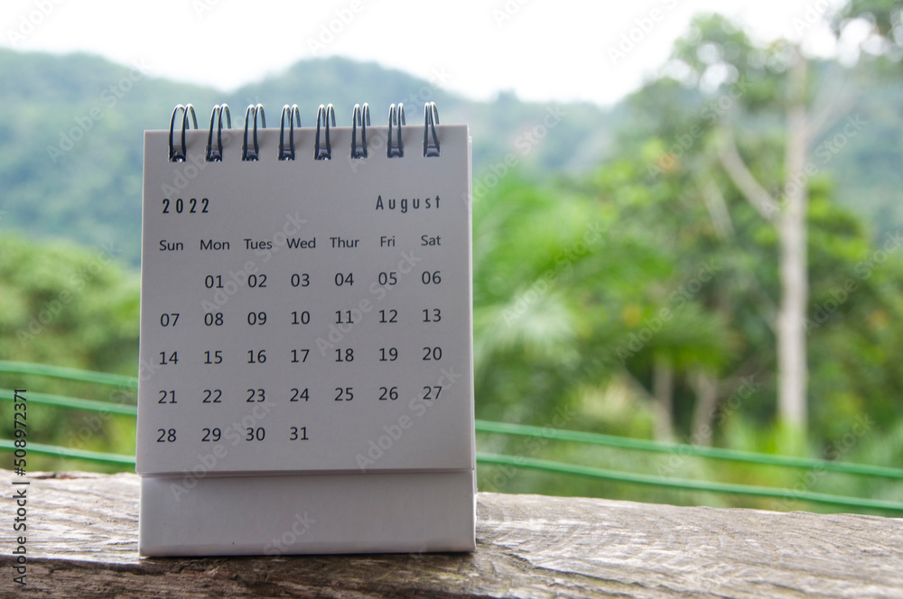 August calendar with blurred nature background. Copy space and new ...