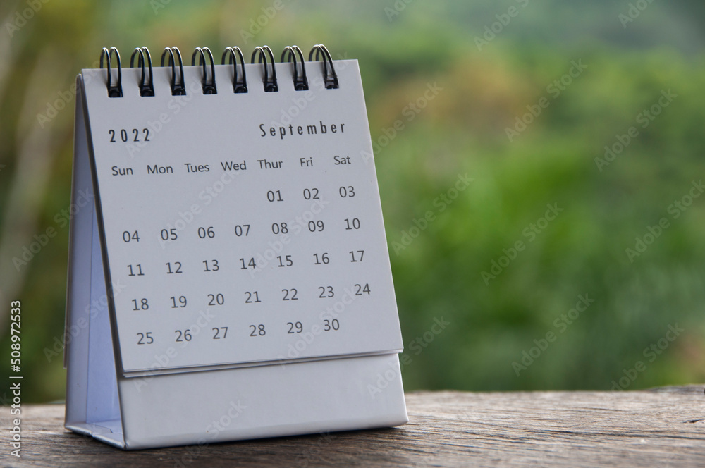 September month calendar with blurred nature background. Copy space and ...