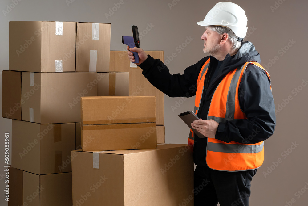 Customs clearance. Customs officer registers mail. Man with scanner in ...