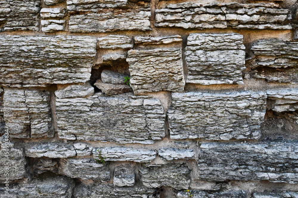 Chalky Stone Bricks in a Wall with Open Space Filled by Rocks Pattern ...