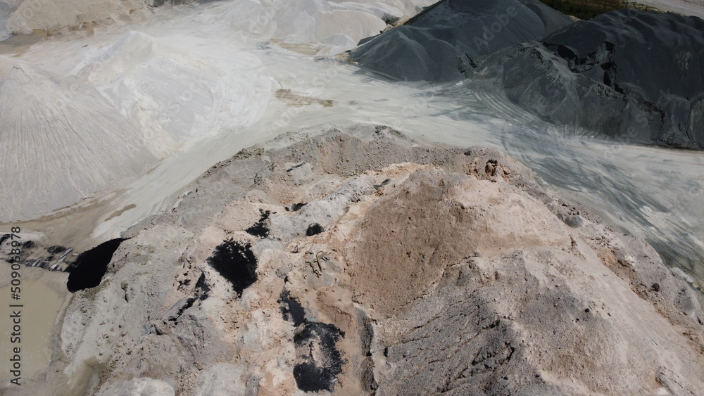 An aerial view of the piles of fine stone in the quarry. Fine stone is ...