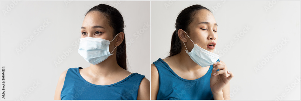 woman taking a breath out of face mask and still wearing face mask in ...