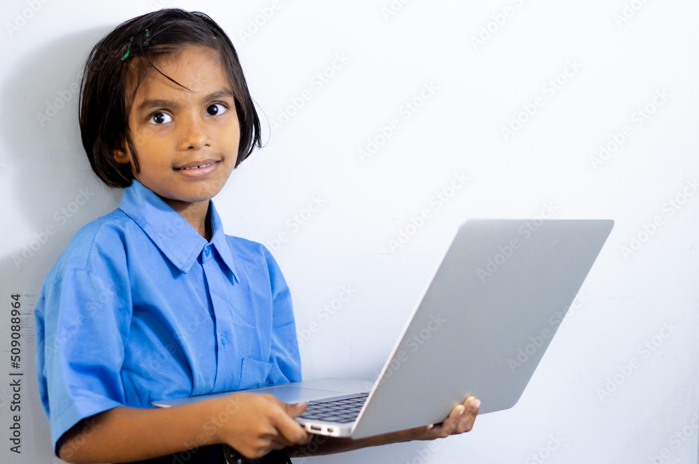 Indian asian small school girl learning online class or attending ...