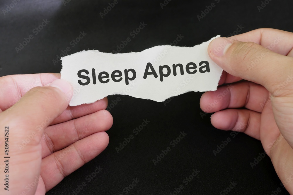 Sleep Apnea sleeping disorder diagnosis concept. Hand holding paper ...