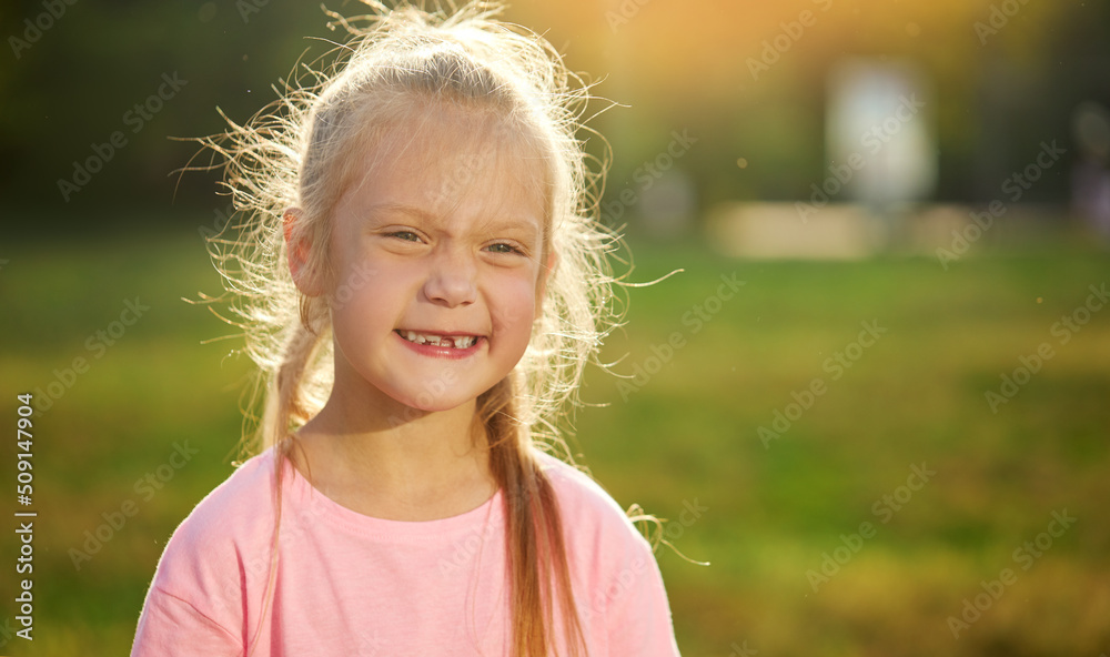 Fanny child face. Sweet little girl with a toothless smile. The first ...