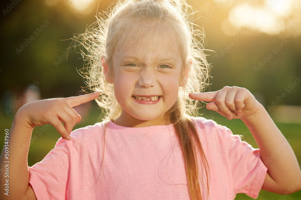 Fanny child face. Sweet little girl with a toothless smile. The first ...