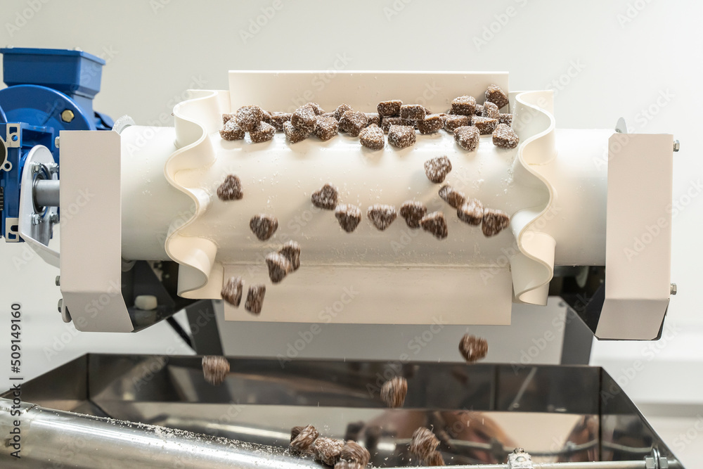 making machine of chocolate sweets. Chocolate factory. Sweets ...