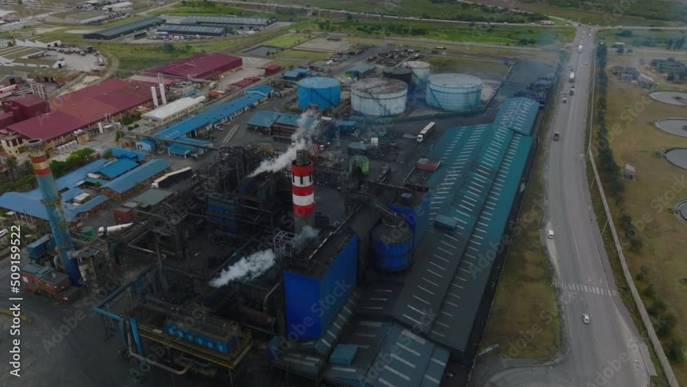 Aerial descending footage of industrial plant. Chemical factory with ...