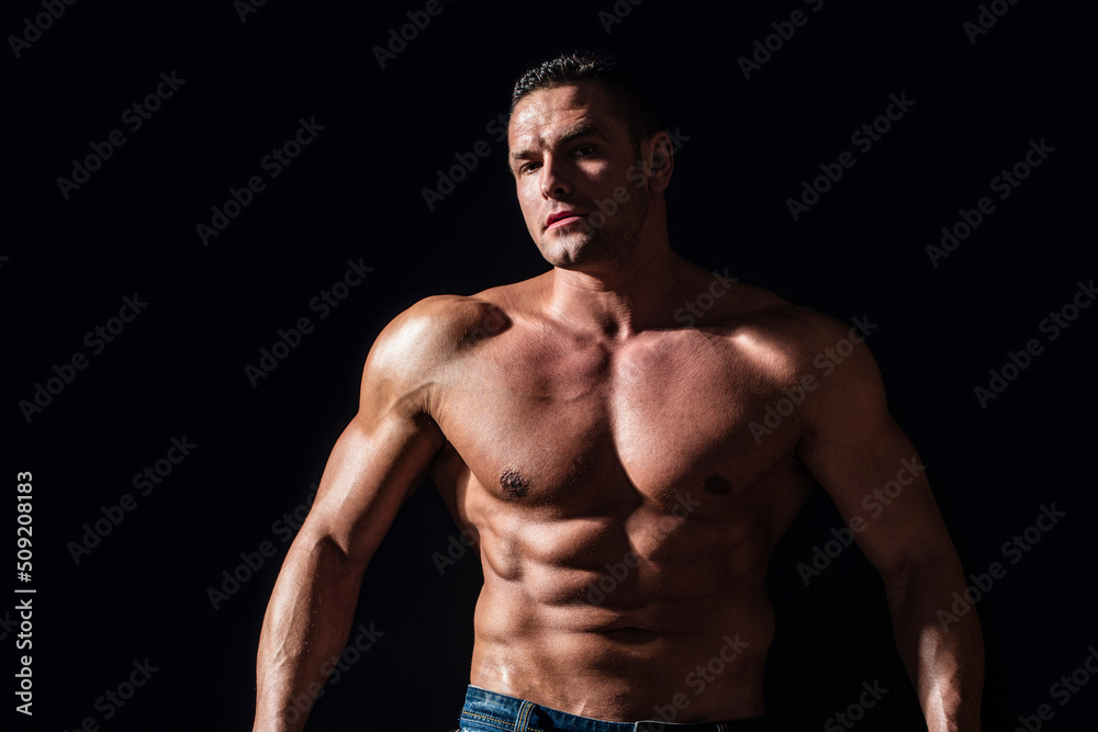 Torso with six packs looks attractive on black background. Isolated on ...