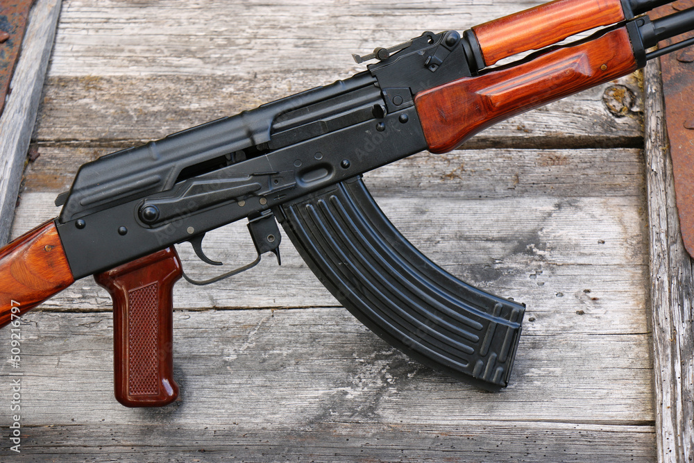 The famous Soviet assault rifle with magazine and cartridges on an old ...