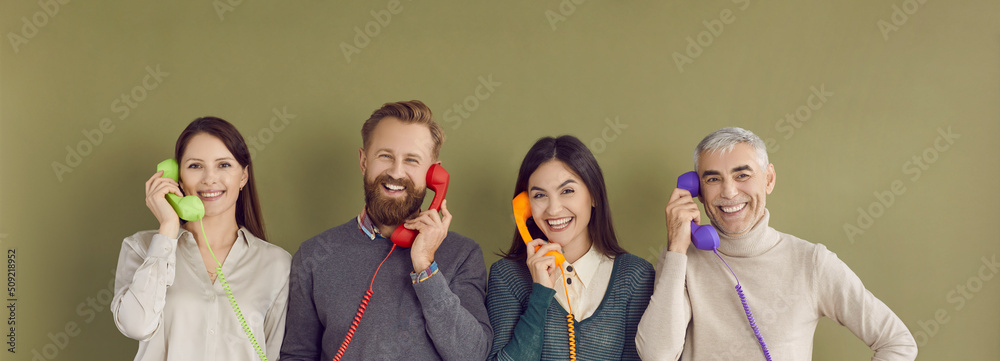 Group of happy people talking on colorful landline phones. Studio ...