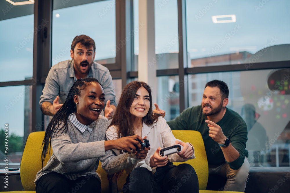 Work colleagues playing video games during their work break Stock Photo ...