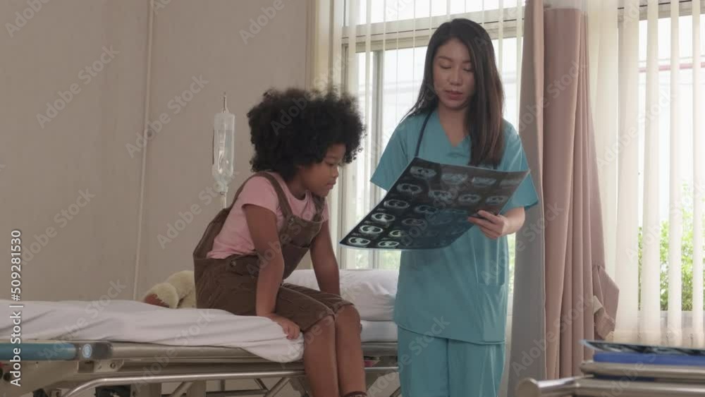 Asian female doctor in uniform health checks African American child ...