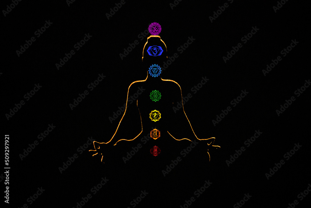 Silhouette of a woman sitting in meditation pose with chakra symbols ...