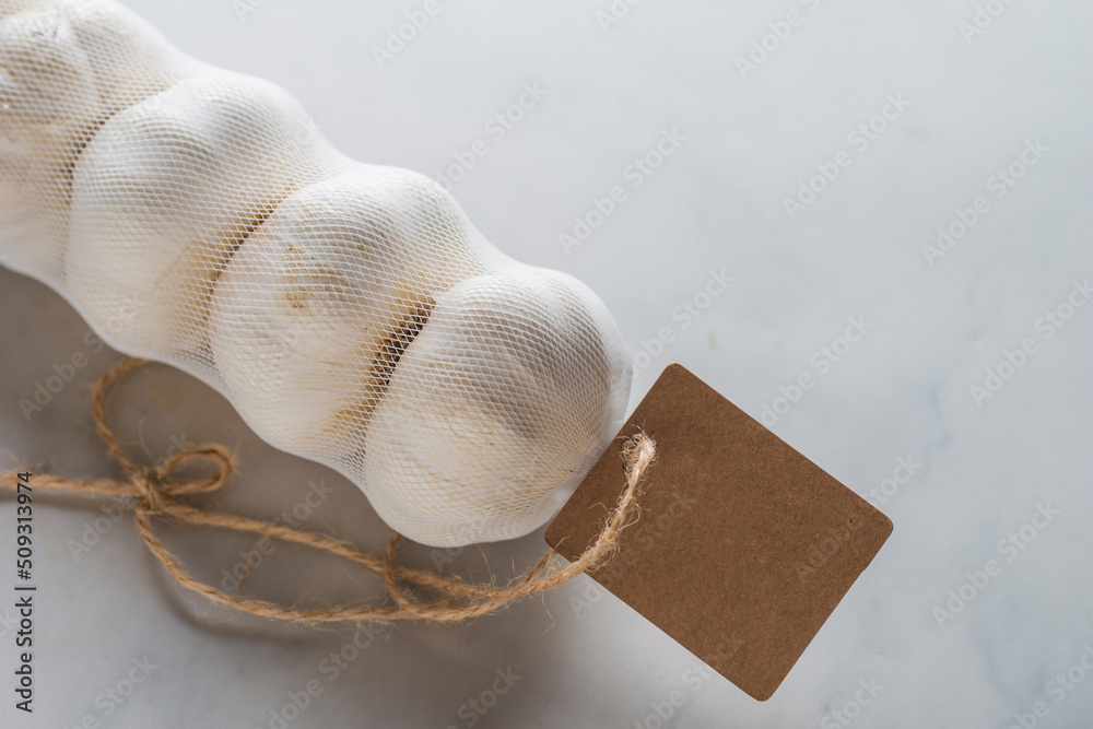 Mesh bags of garlic Stock Photo | Adobe Stock
